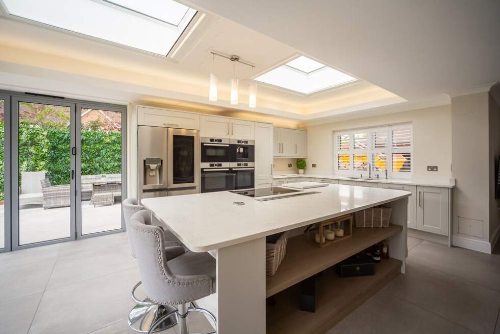 Howdens Dove Grey Shaker Kitchen with Island & Granite Worktops ...