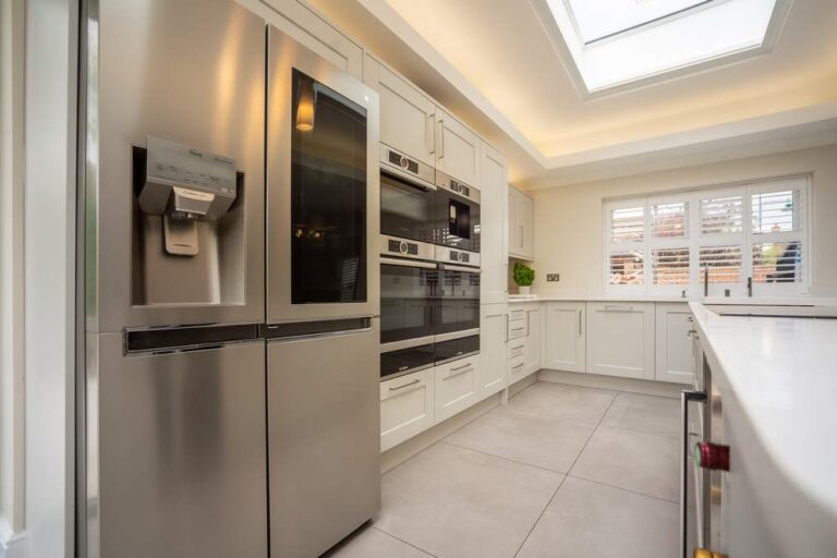 Howdens Dove Grey Shaker Kitchen with Island & Granite Worktops ...